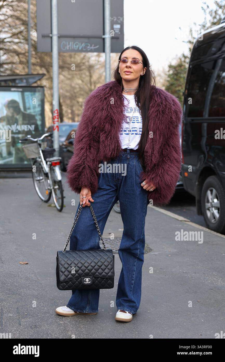 Milan, Italy. 26th Feb, 2025. A guest poses for photos before FW 2025/ ...