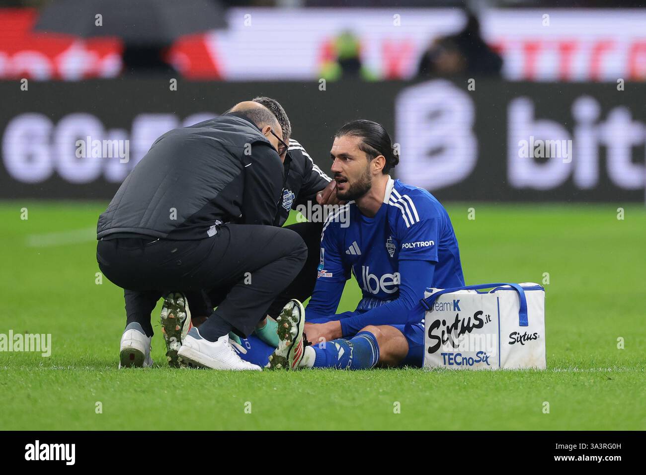 Milan, Italy, 15th March 2025. Alberto Dossena of Como 1907 receives ...