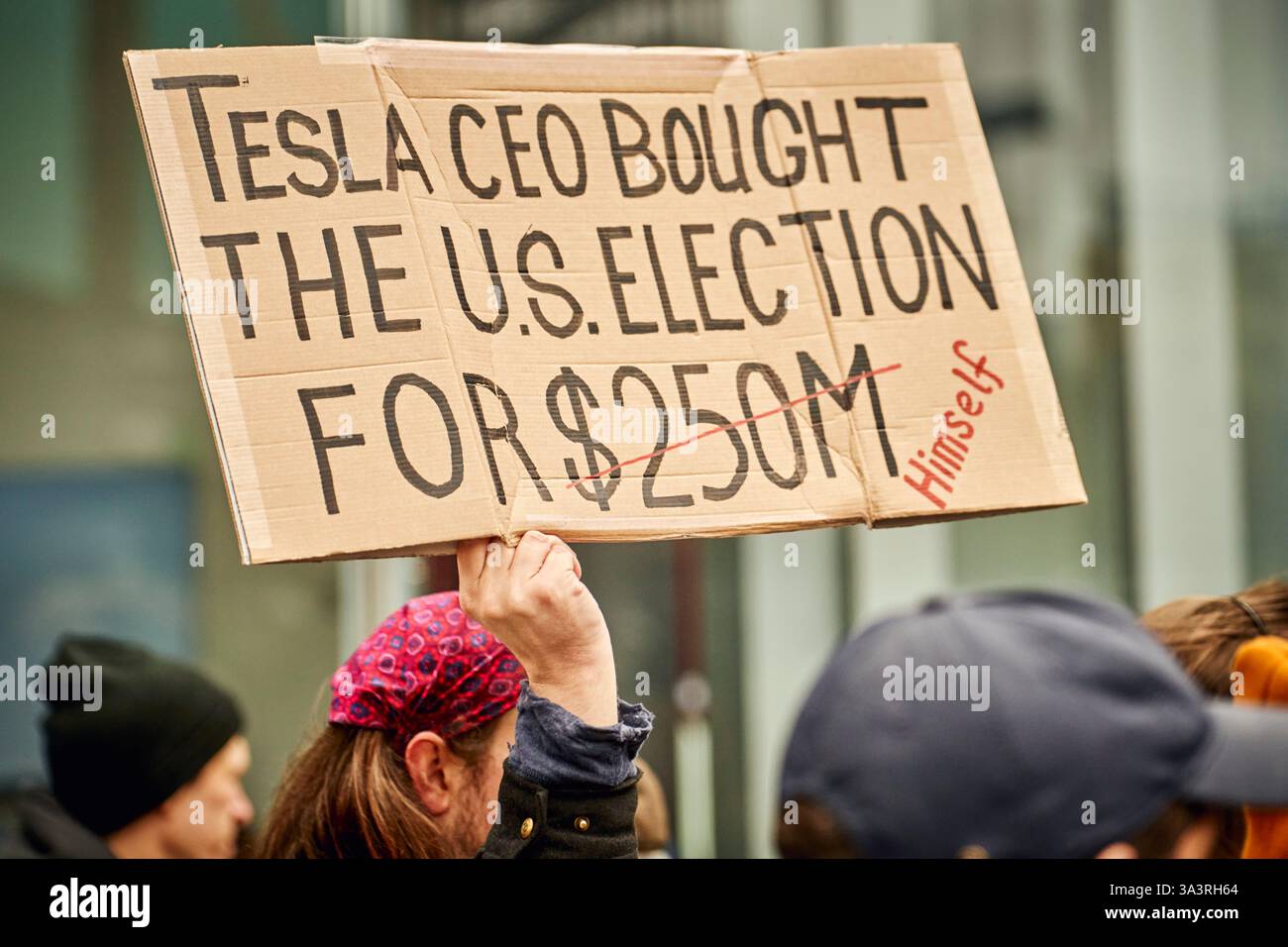 New York, Ny, USA. 15th Mar, 2025. Protestor holds sign ''Tesla CEO ...