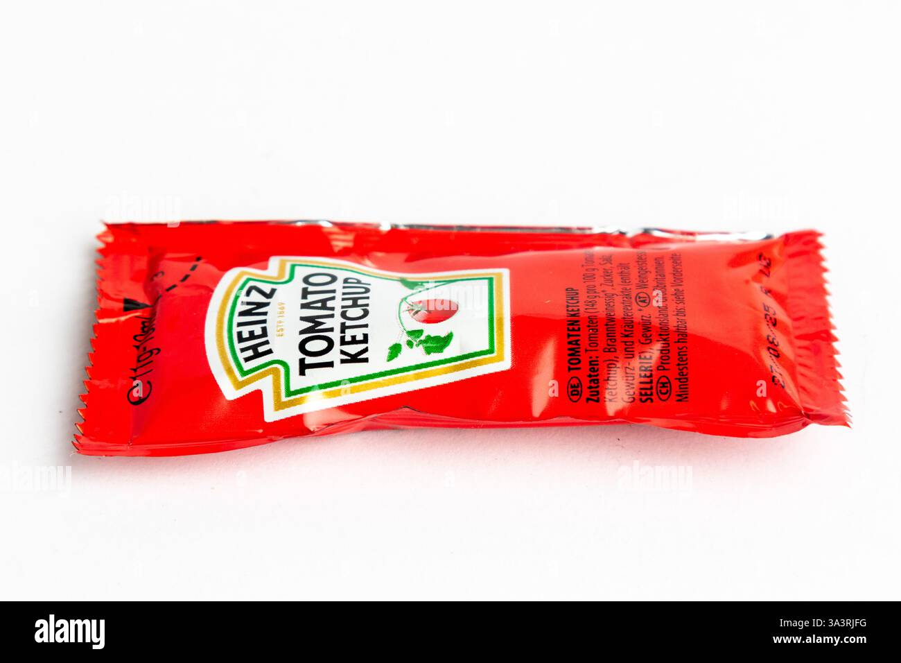 London, United Kingdom 10th March 2025 :- Sachet of Heinz Tomato Ketchup. Studio Shot Against A ...