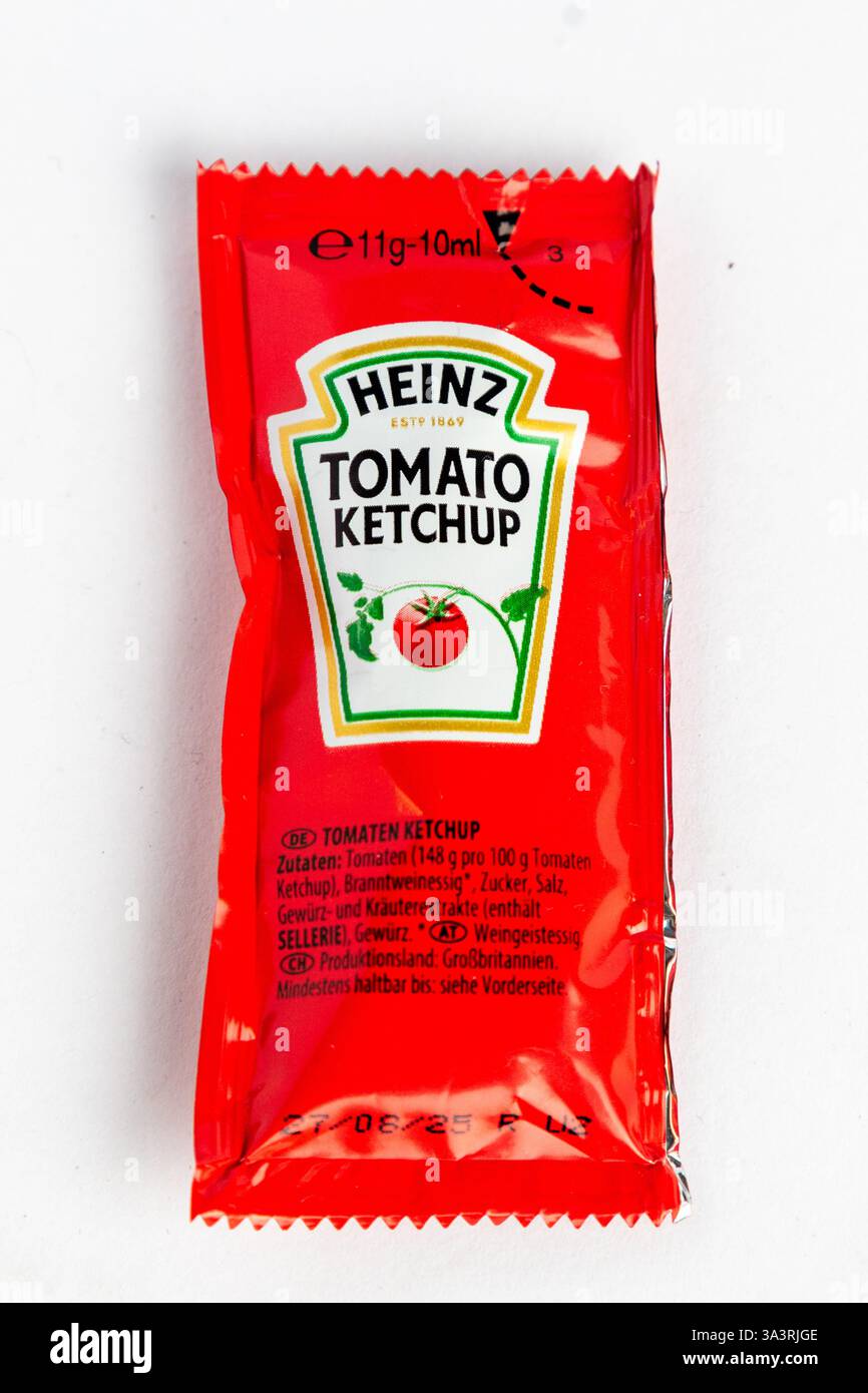 London, United Kingdom 10th March 2025 :- Sachet of Heinz Tomato Ketchup. Studio Shot Against A ...
