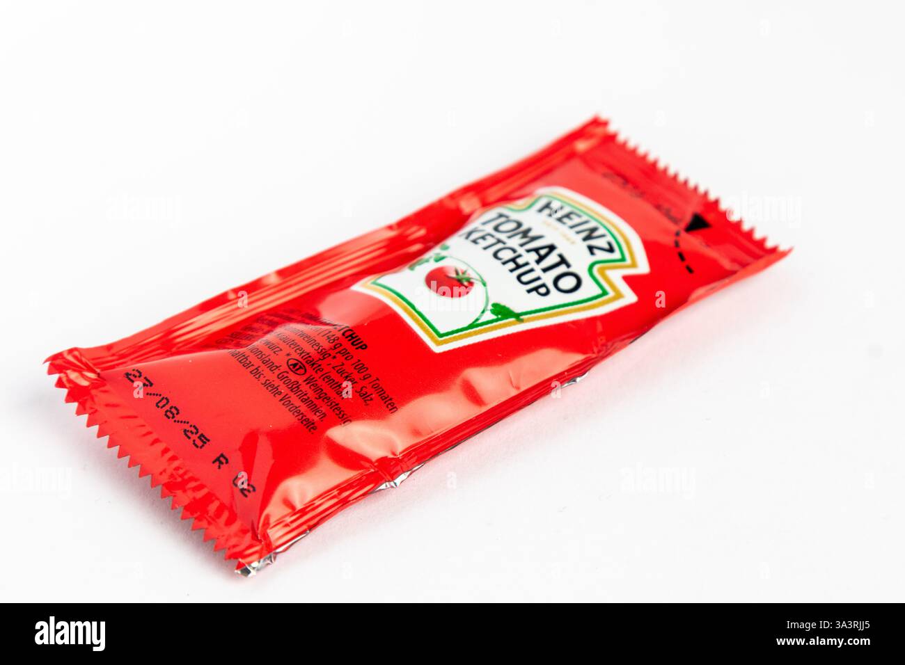 London, United Kingdom 10th March 2025 :- Sachet of Heinz Tomato Ketchup. Studio Shot Against A ...