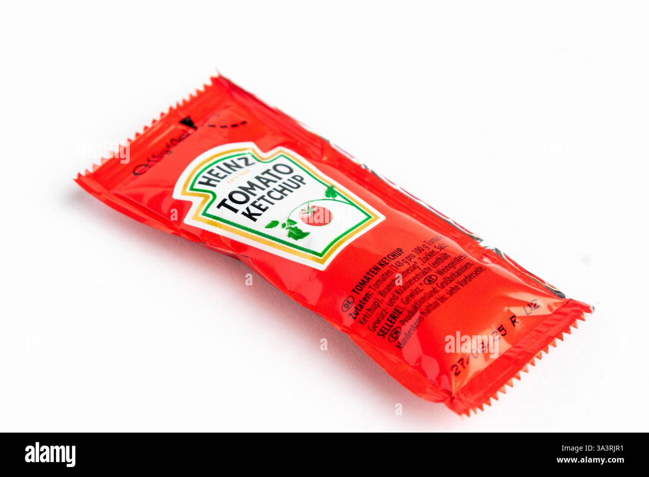 London, United Kingdom 10th March 2025 :- Sachet of Heinz Tomato Ketchup. Studio Shot Against A ...