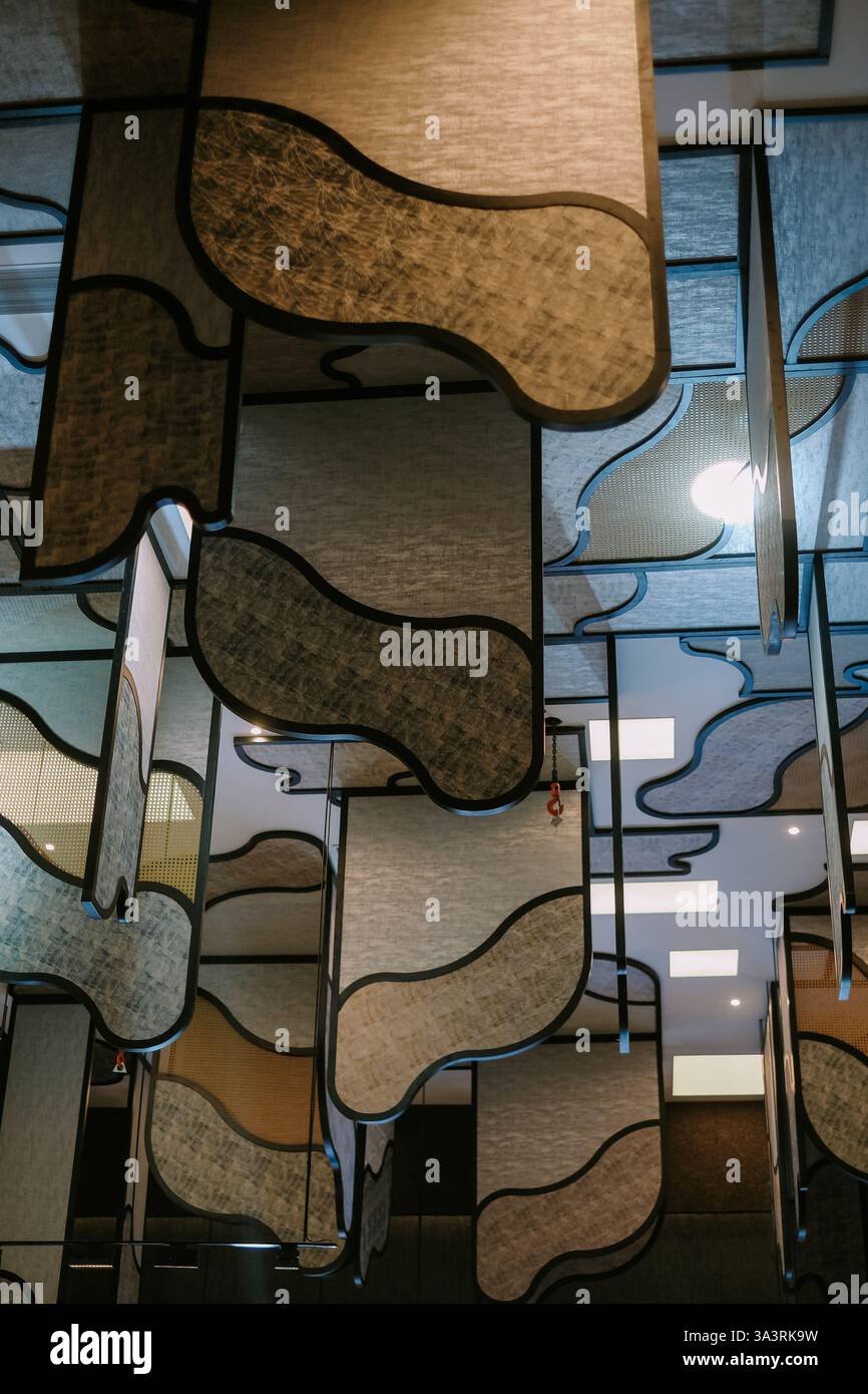 A visually captivating ceiling installation featuring a series of ...