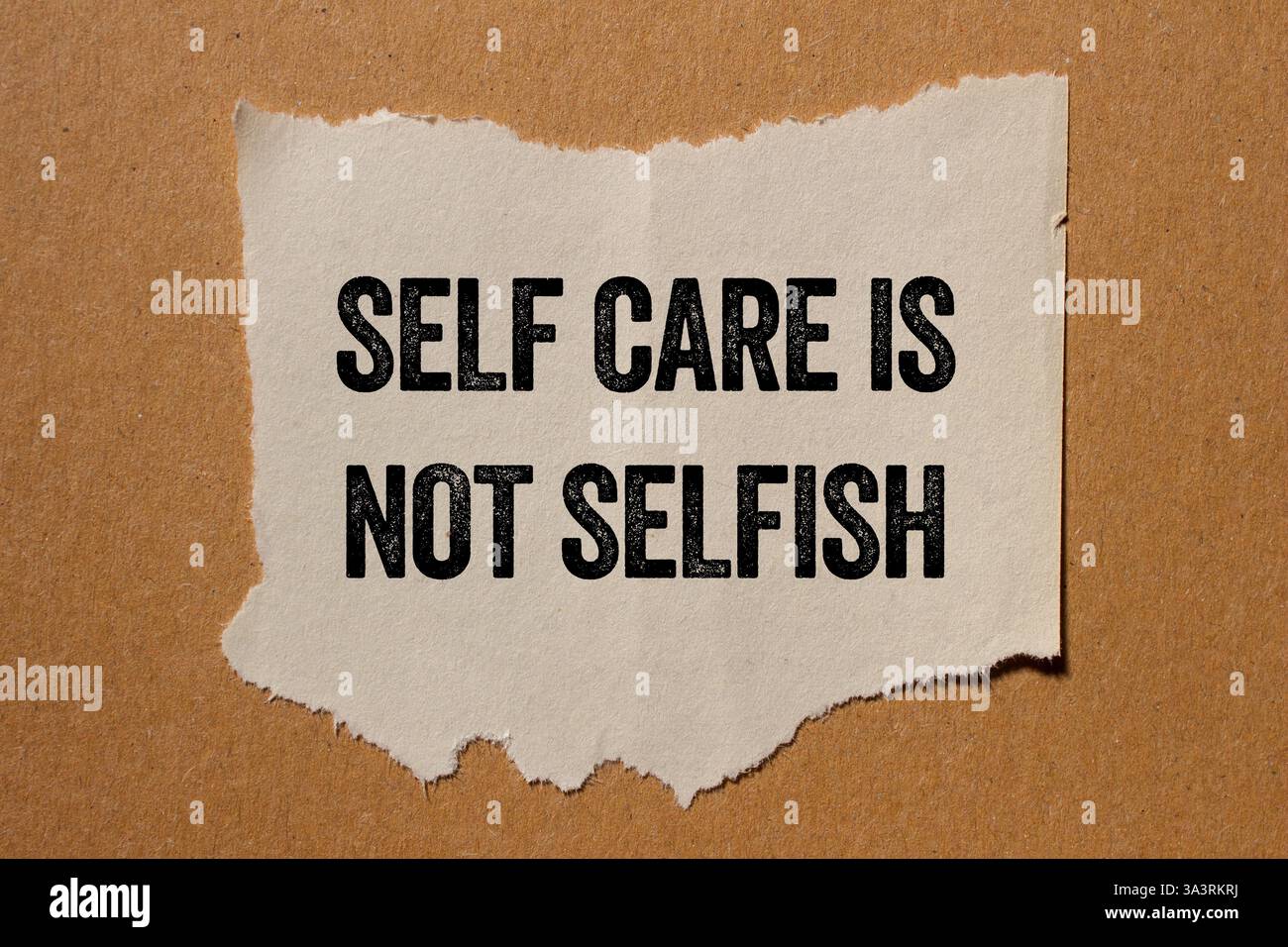 Self care is not selfish message written on ripped torn paper piece on ...