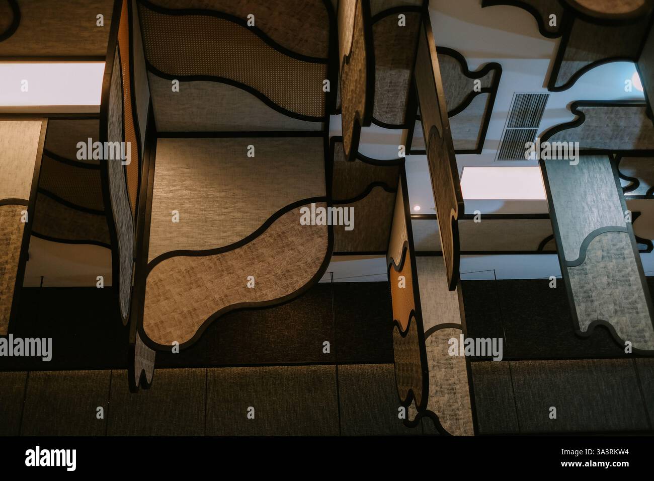 Unique and stylish acoustic panels suspended from the ceiling, designed ...