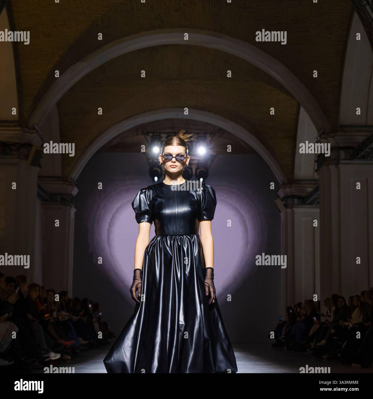 A model captures attention on the runway during the GURANDA show at ...