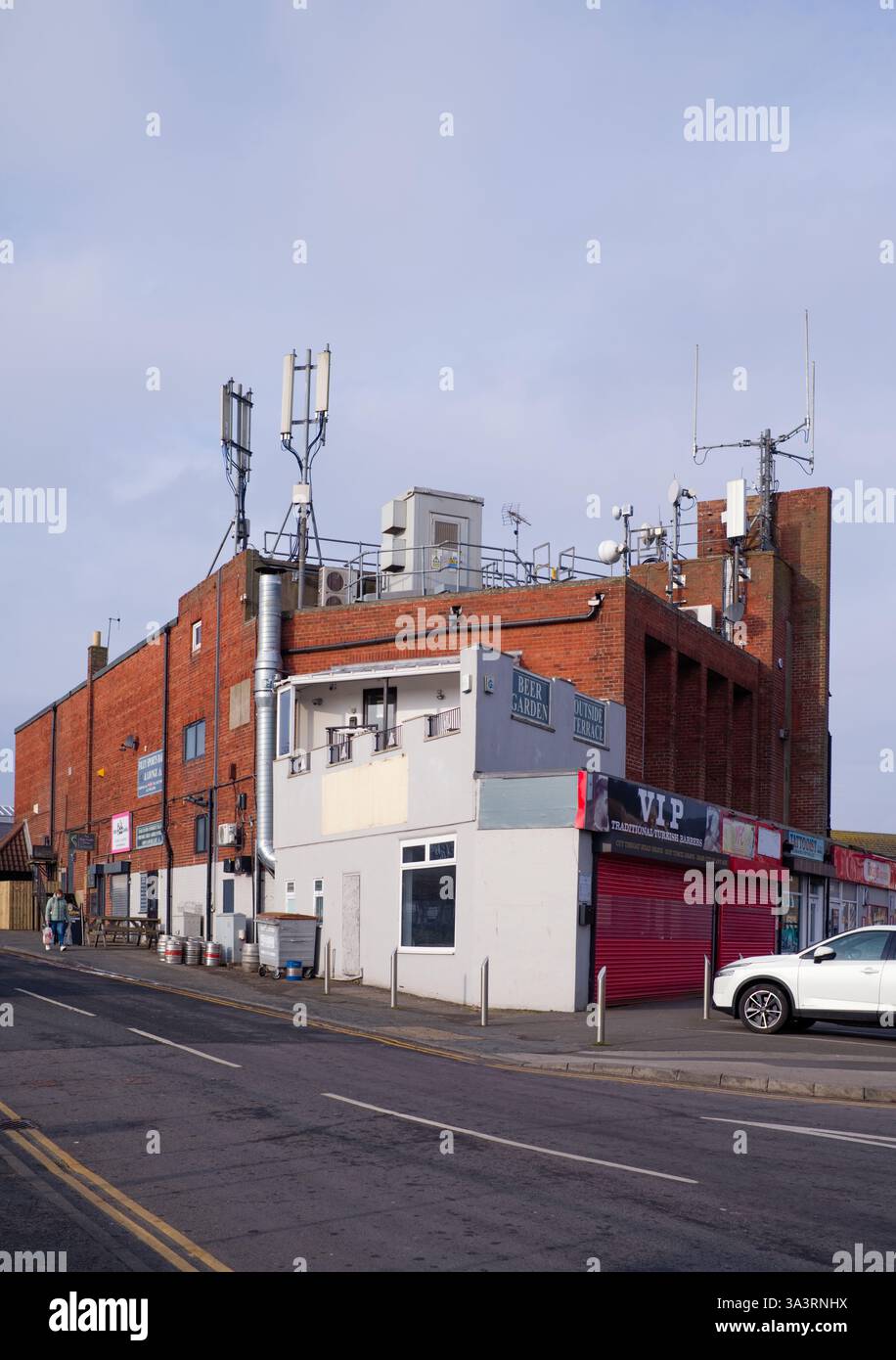 The snooker hall building in Filey has many masts on the roof Stock ...