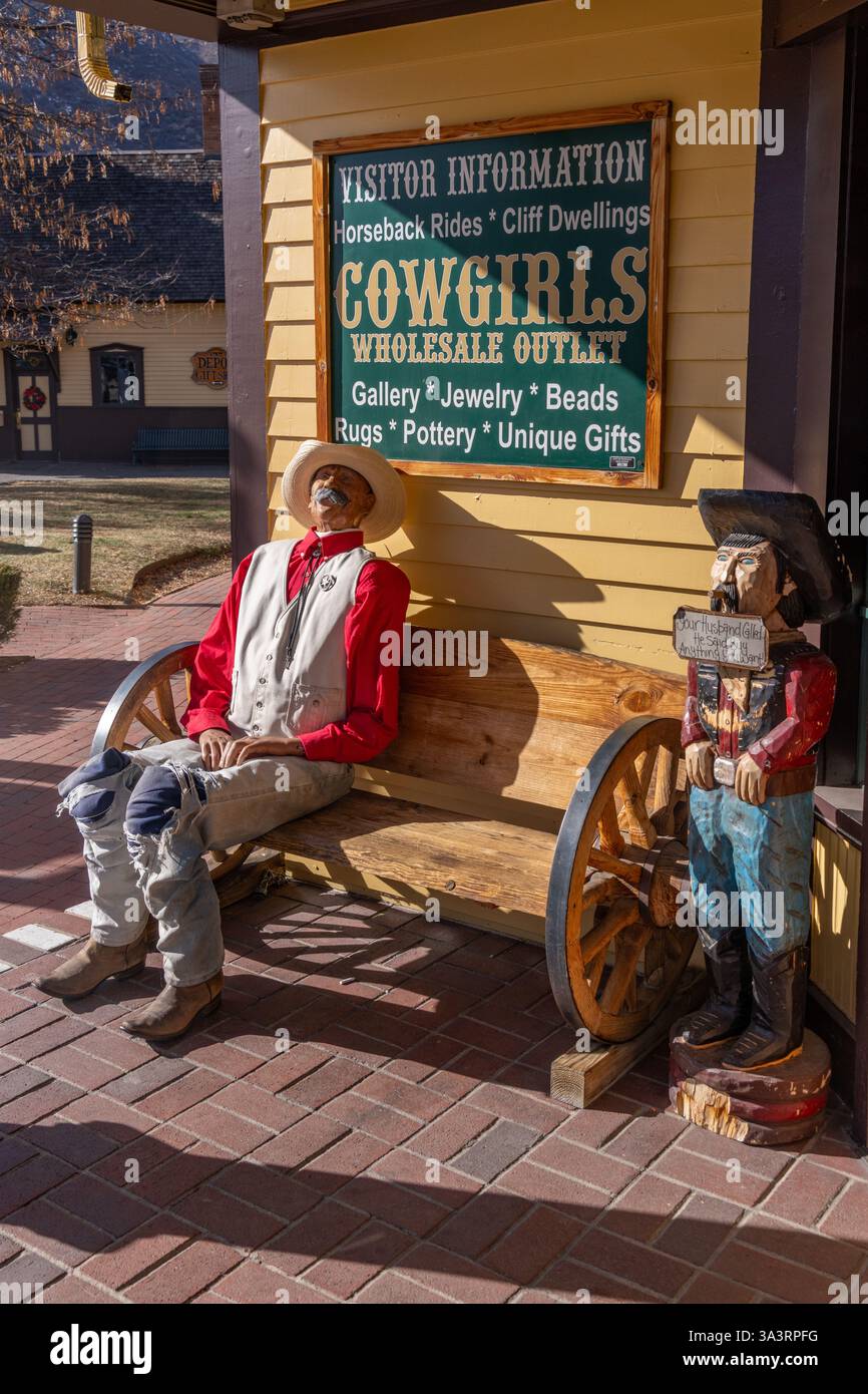 Wooden cowboy mannequins outside a business in historic Durango ...