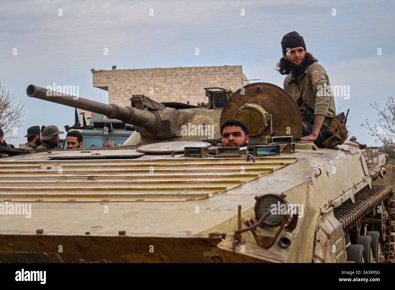 Syrian troops gather in the village of Hawsh al-Sayyid Ali, located 2 ...