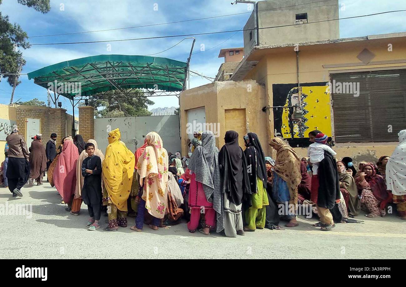 A large numbers of people are gathered in a queue for relief supplies during the Holy Month of ...