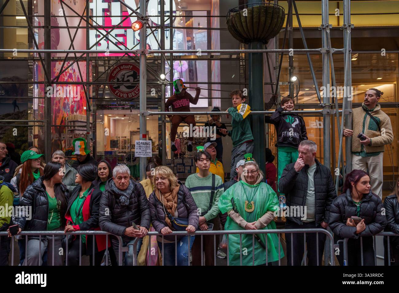 Crowds watch the 264th New York City Saint Patrick's Day Parade, Monday ...
