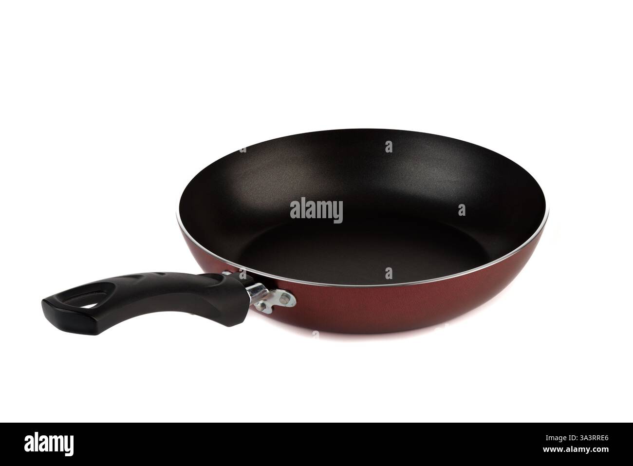 Modern new frying pan with black handle on white background. Copy space ...