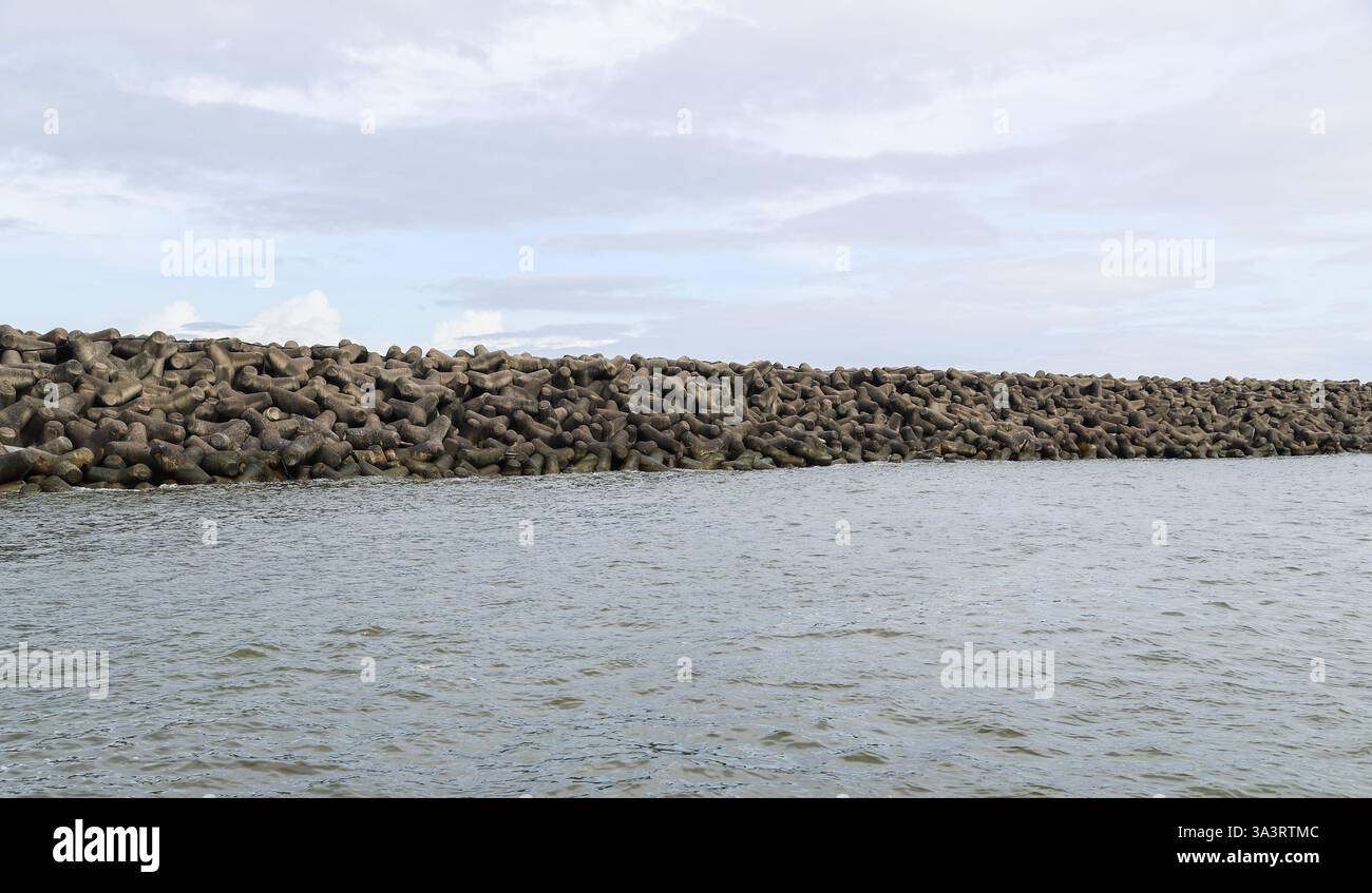 Concrete tetrapods forming a robust breakwater along the coastline to ...