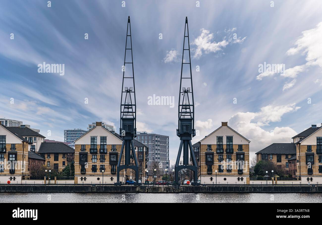 Disused cranes and modern hosuing development, Royal Victoria Dock on ...