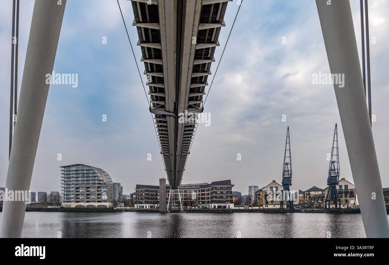 View under Royal Victoria Dock footbridge on Thames River, London ...