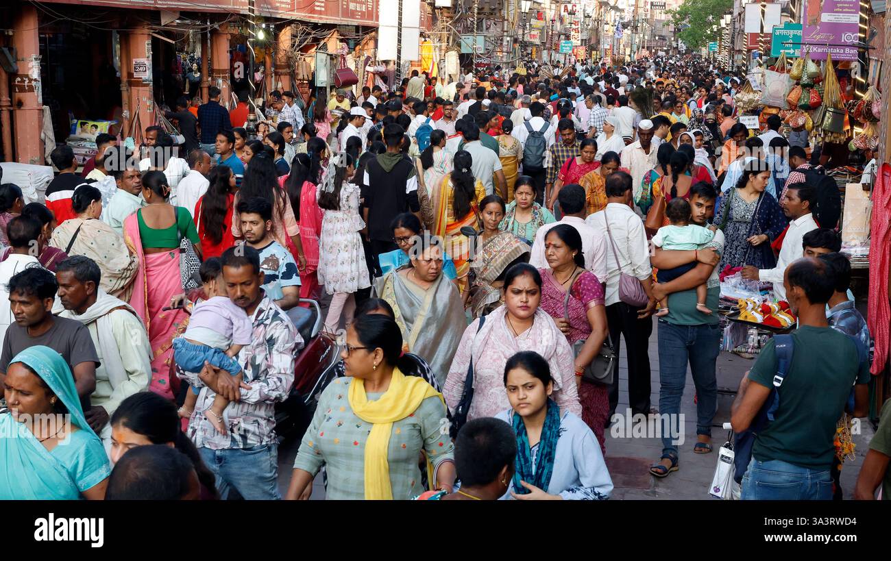 Traffic and pedestrians on a busy and congested Dashashwamedh Ghat Road ...