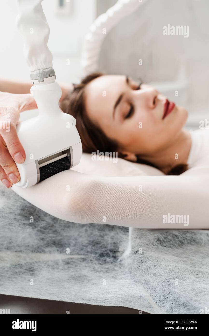 Lymphatic drainage procedure. Doctor is using lymphatic drainage to ...