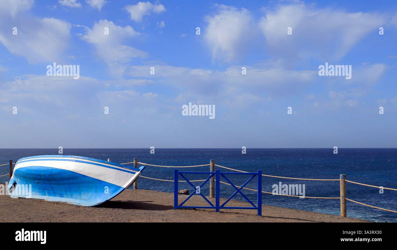 Novelty bench made out of an old rowing boat, looking out to sea over ...