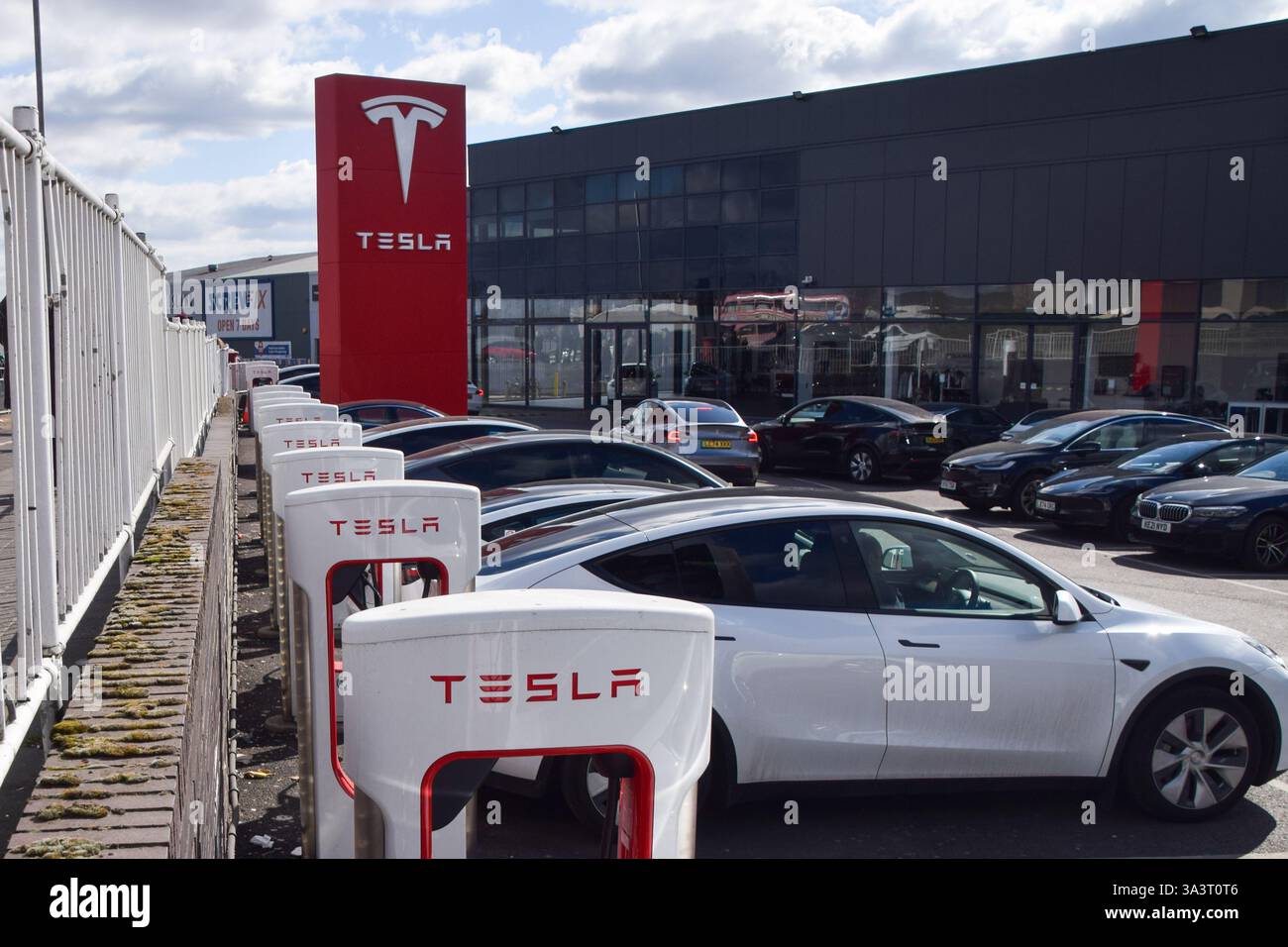 London, UK. 15th March 2025. A view cars charging at the Tesla Centre ...