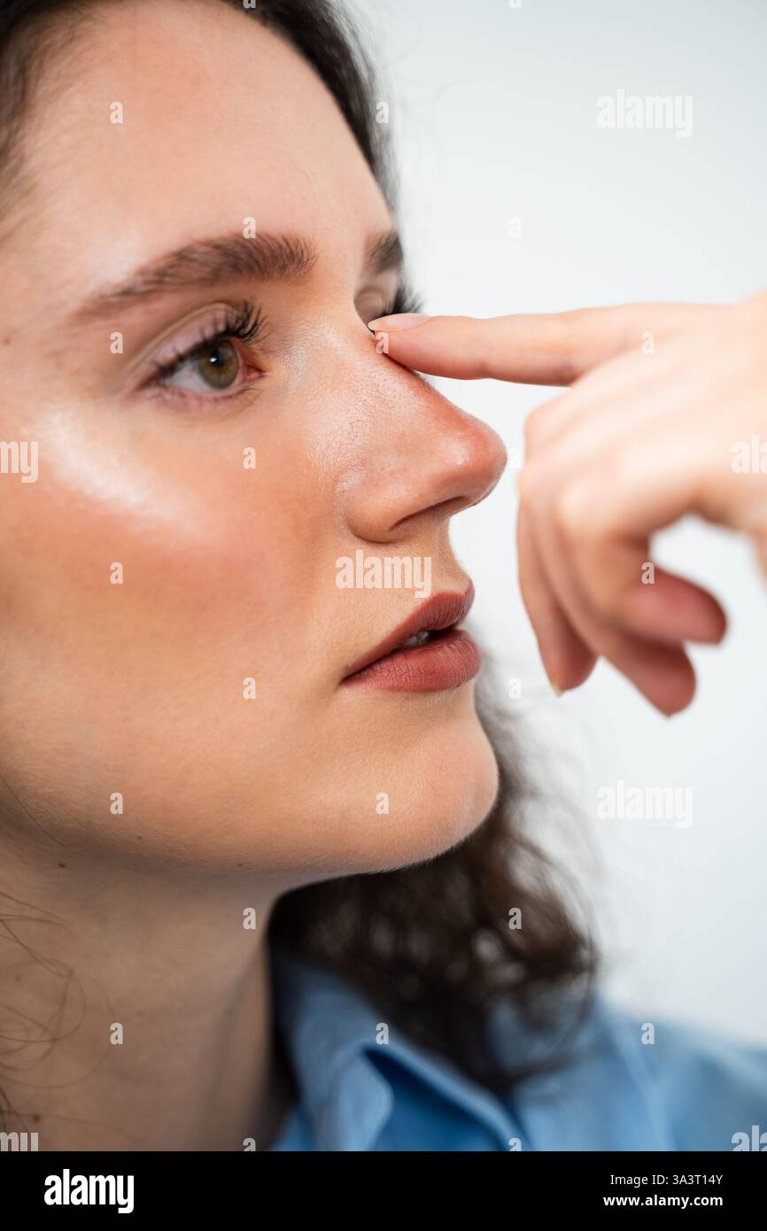 Girl touches her nose and smiles after septoplasty nose surgery ...