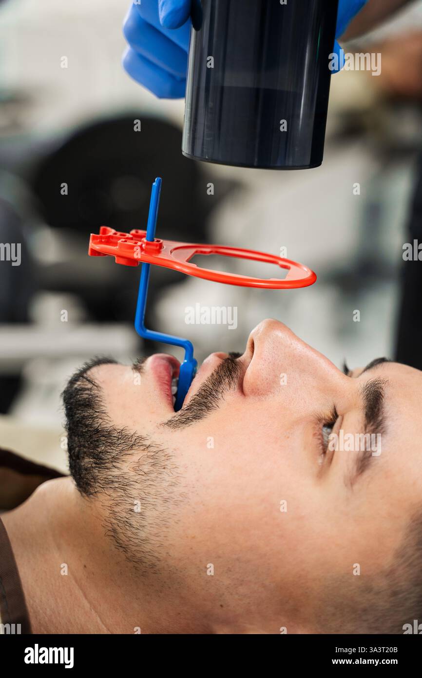 X-ray teeth scanning process. Dentist uses x-ray hardware to analyze ...