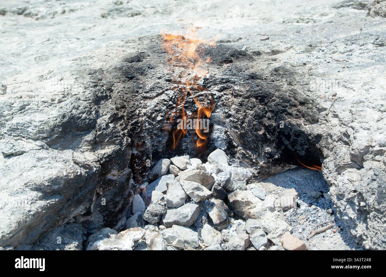 The close view of a fire that is the result of burning gases ...