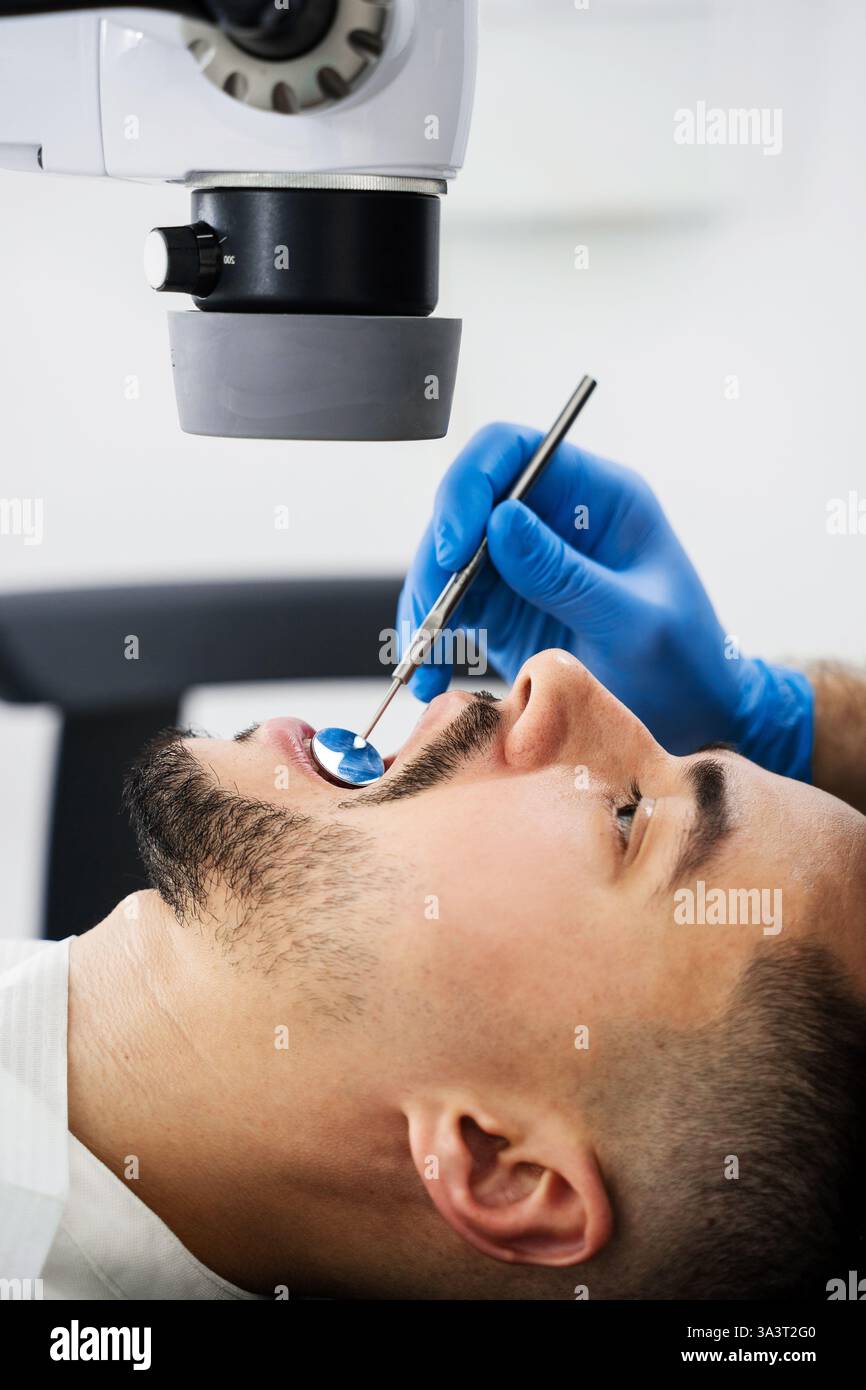 Operating dental digital microscope working process. Dentist uses ...