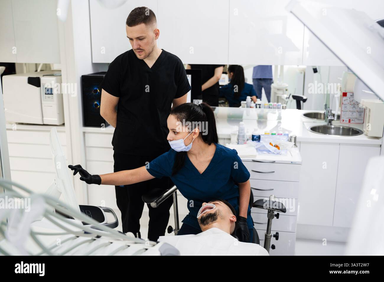 Digital teeth scanning preparation. Dentist and assistant preparing x ...