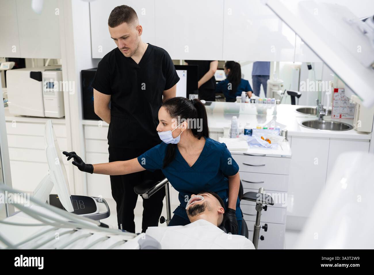 Digital teeth scanning preparation. Dentist and assistant preparing x ...