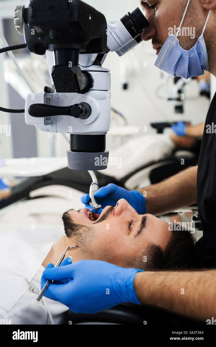 Polishing teeth with digital microscope in stomatology clinic. Digital ...