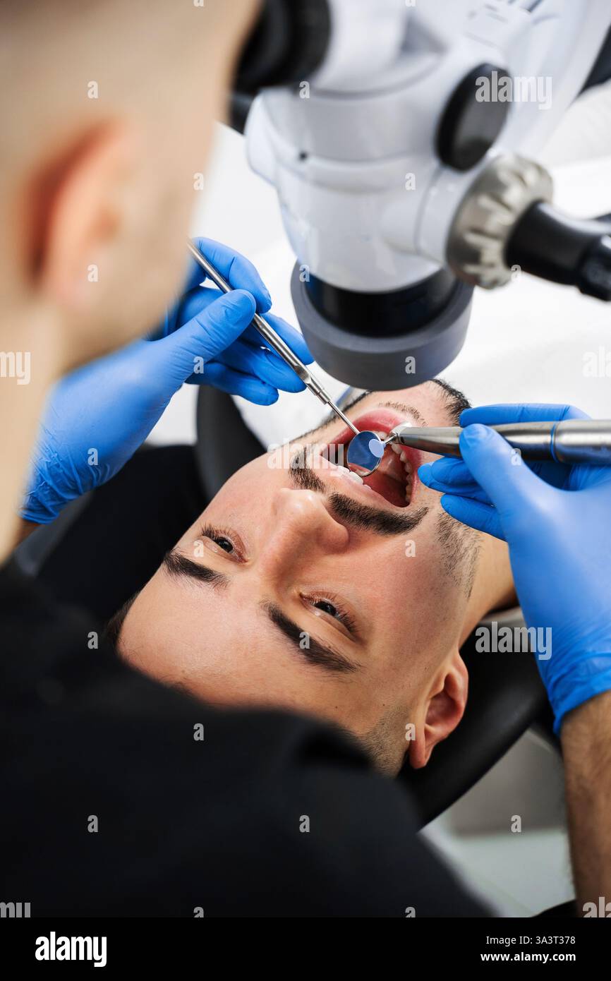 Polishing teeth with digital microscope in stomatology clinic. Digital ...