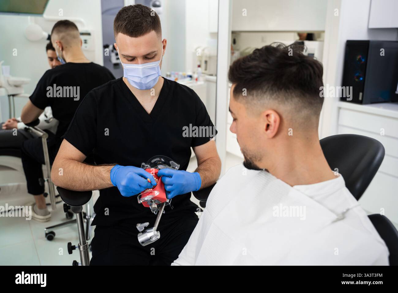Teeth brushing technique showing by dentist. Doctor uses jaw dental ...