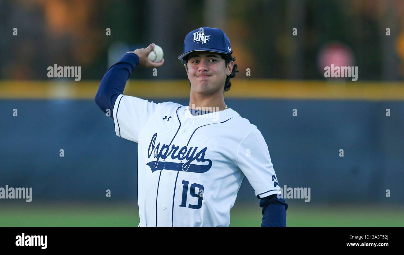 North Florida infielder Javier Calzadilla (19) warms up before an NCAA ...