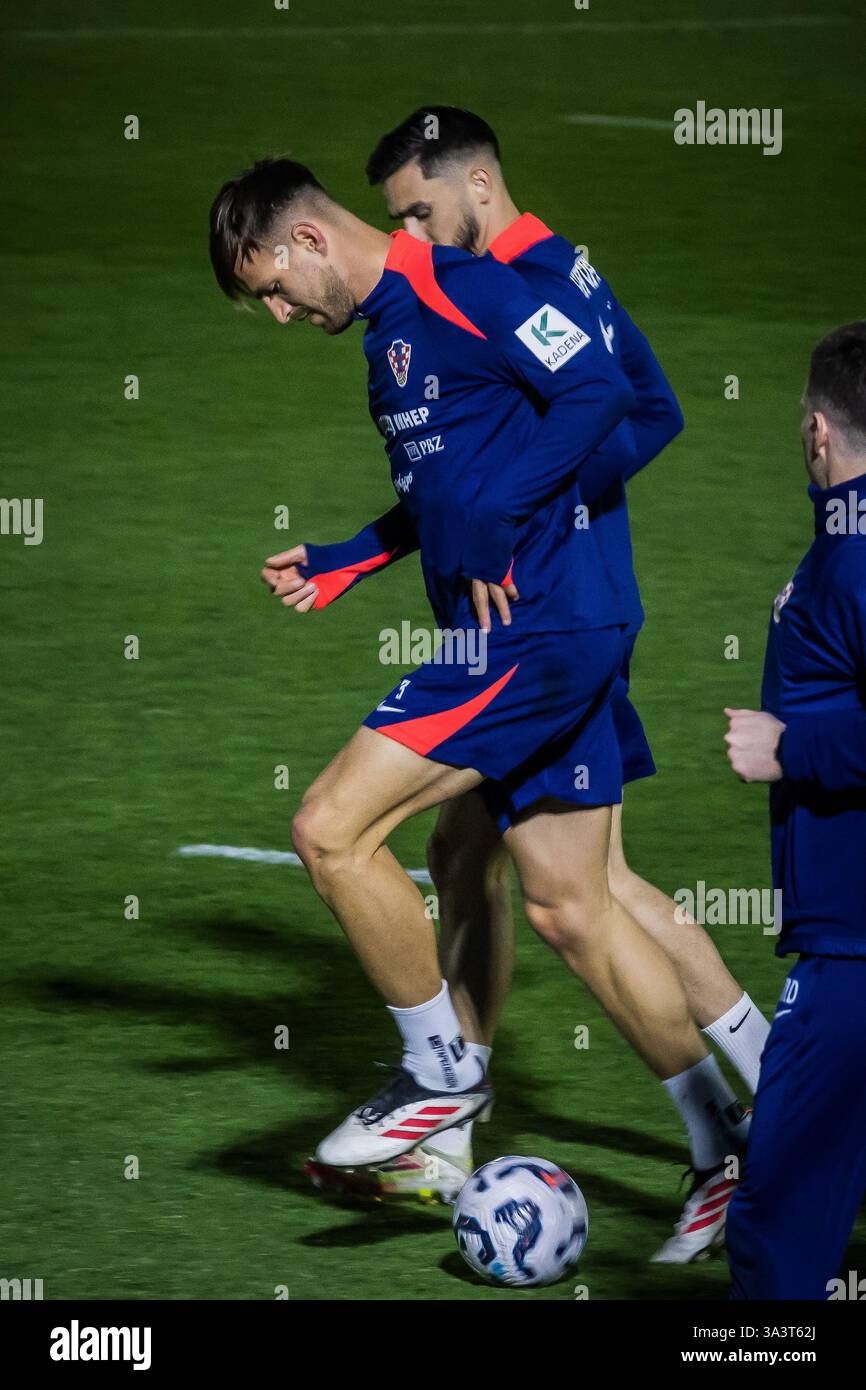 Split, Hrvatska. 17th Mar, 2025. Croatia's Marin Pongracic warms up ...