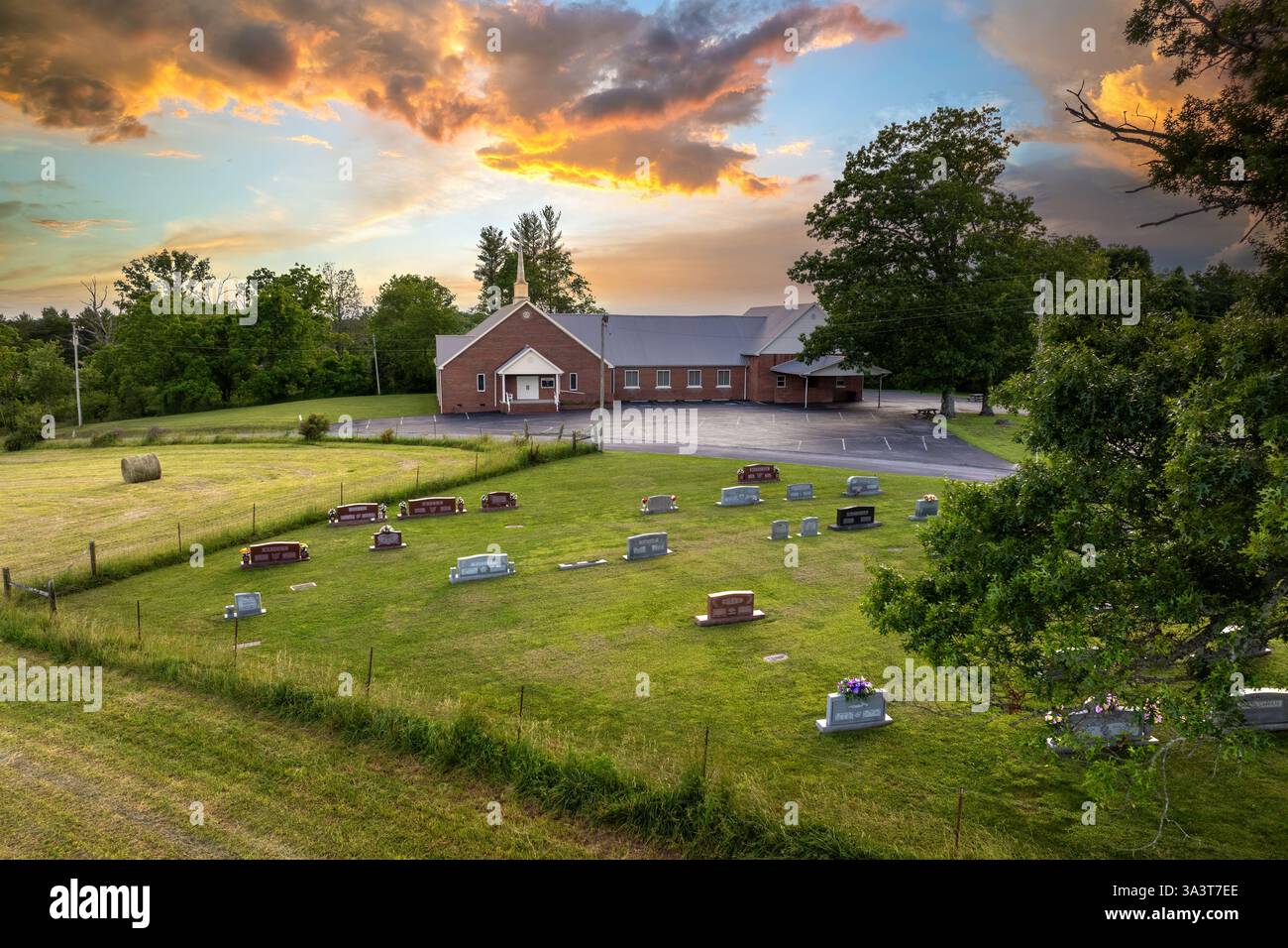 Graveyard burial place with many tombstones at small American church ...