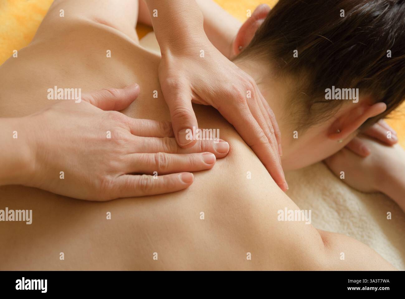Back, neck and shoulder massage performed on a female Stock Photo - Alamy