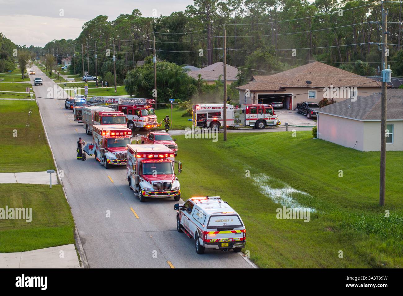 Fire engine trucks and ambulance vehicles responding to fire alarm ...