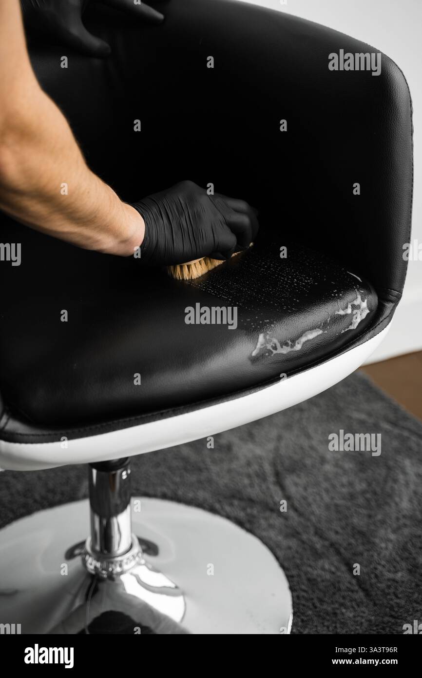 Cleaning is washing leather chair with a brush. Effective brush ...