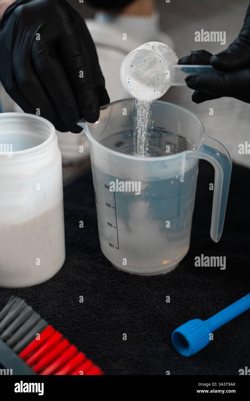 Pouring dry cleaning powder into water. Measuring the ratio of oxygen ...