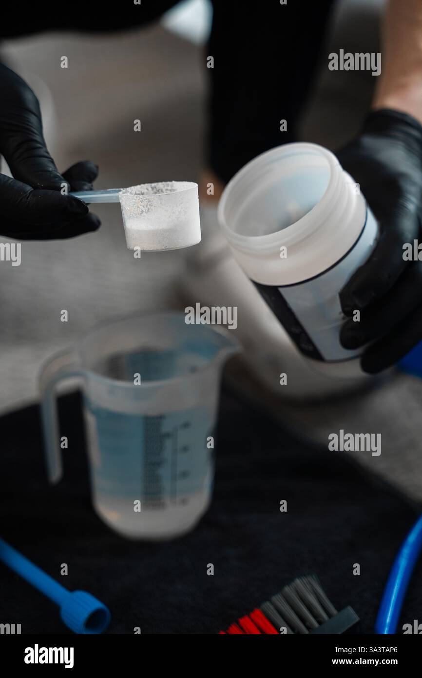 Pouring dry cleaning powder into water. Measuring the ratio of oxygen ...
