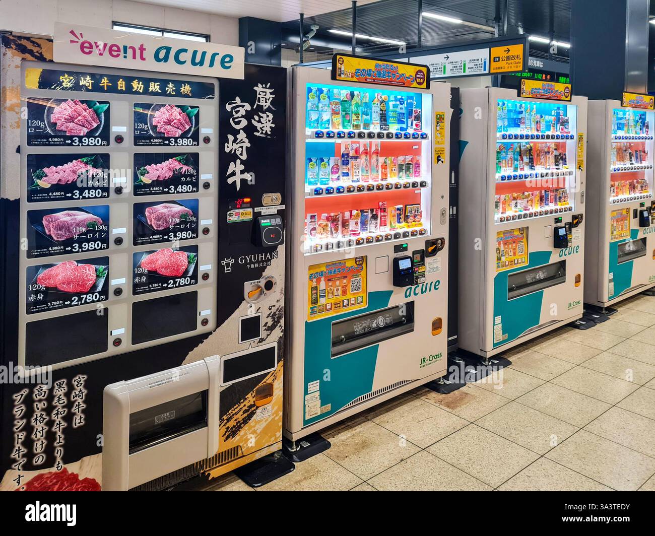 A Miyazaki Beef and several drinks vending machines at a train station ...