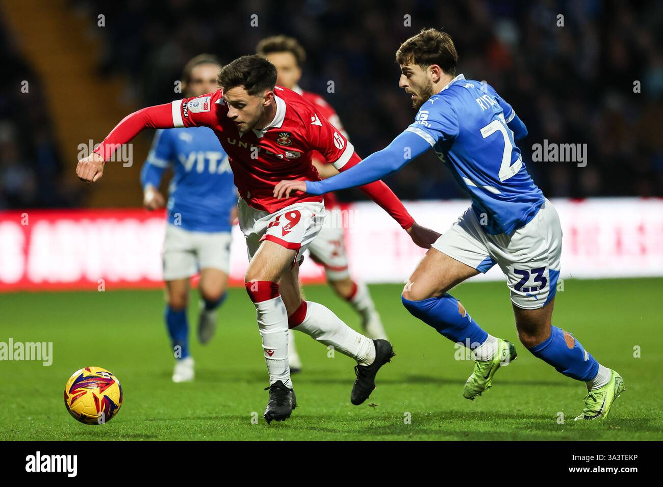 Stockport County’s Ryan Rydel and Wrexham’s Ryan Barnett during the Sky ...