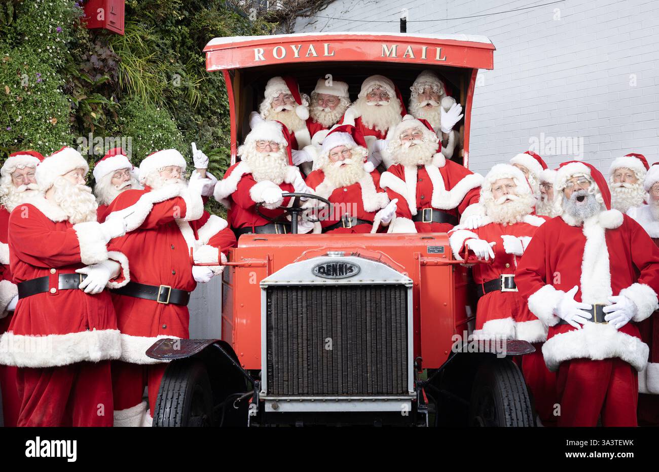 EDITORIAL USE ONLY Men dressed as Father Christmas performers take part ...