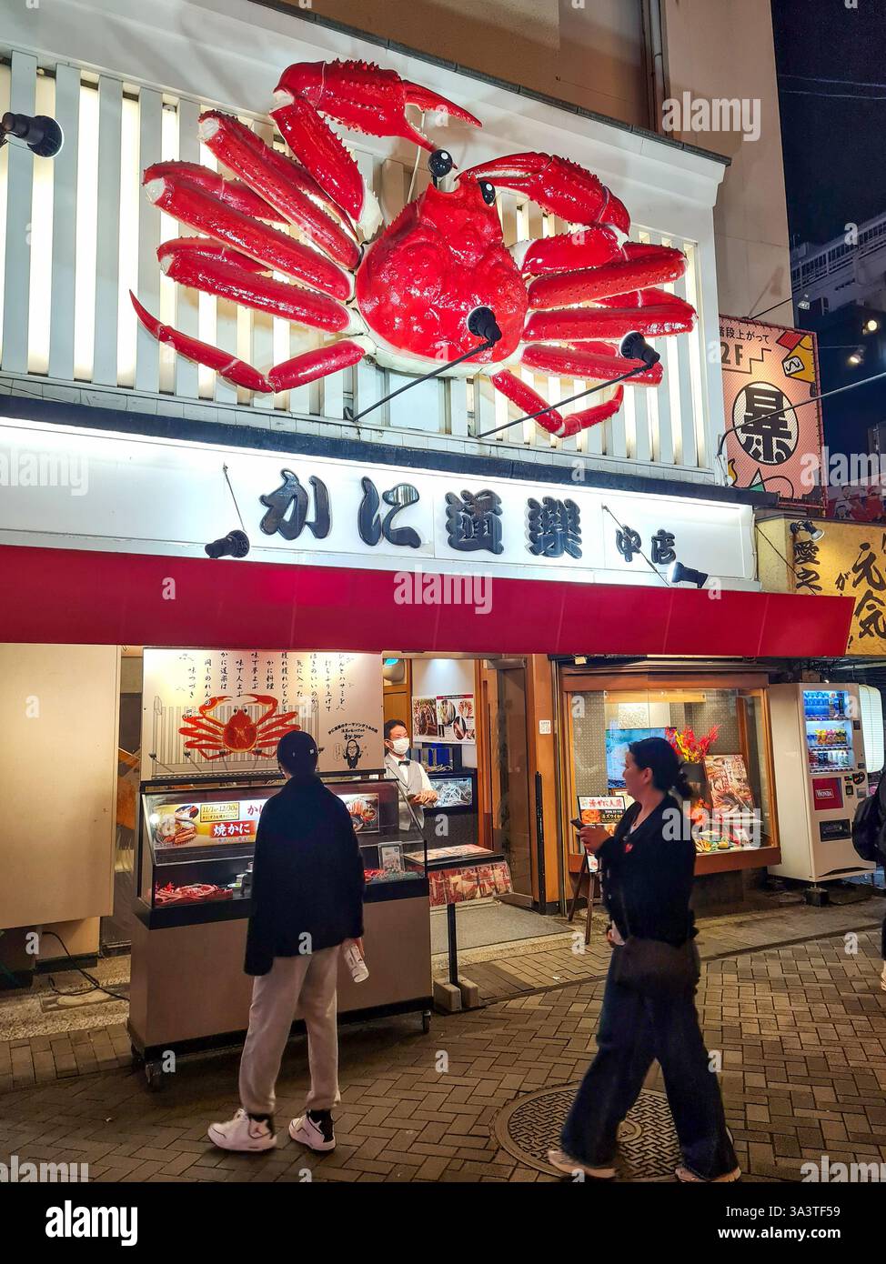 Dotonbori with the famous big crab sign restaurant in Osaka, Japan ...