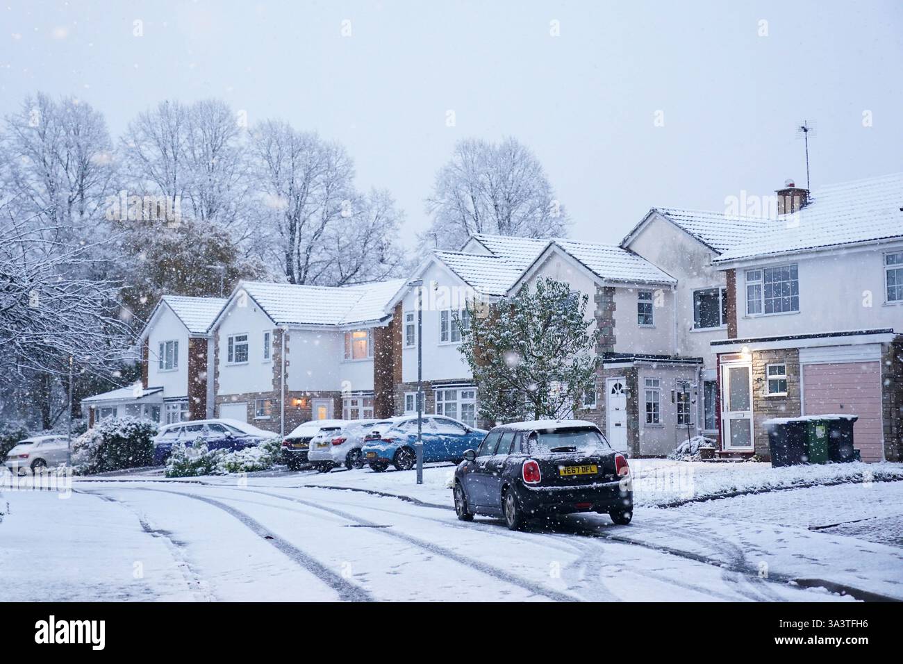 Snow-covered homes after overnight snowfall in Warwick. The UK is ...