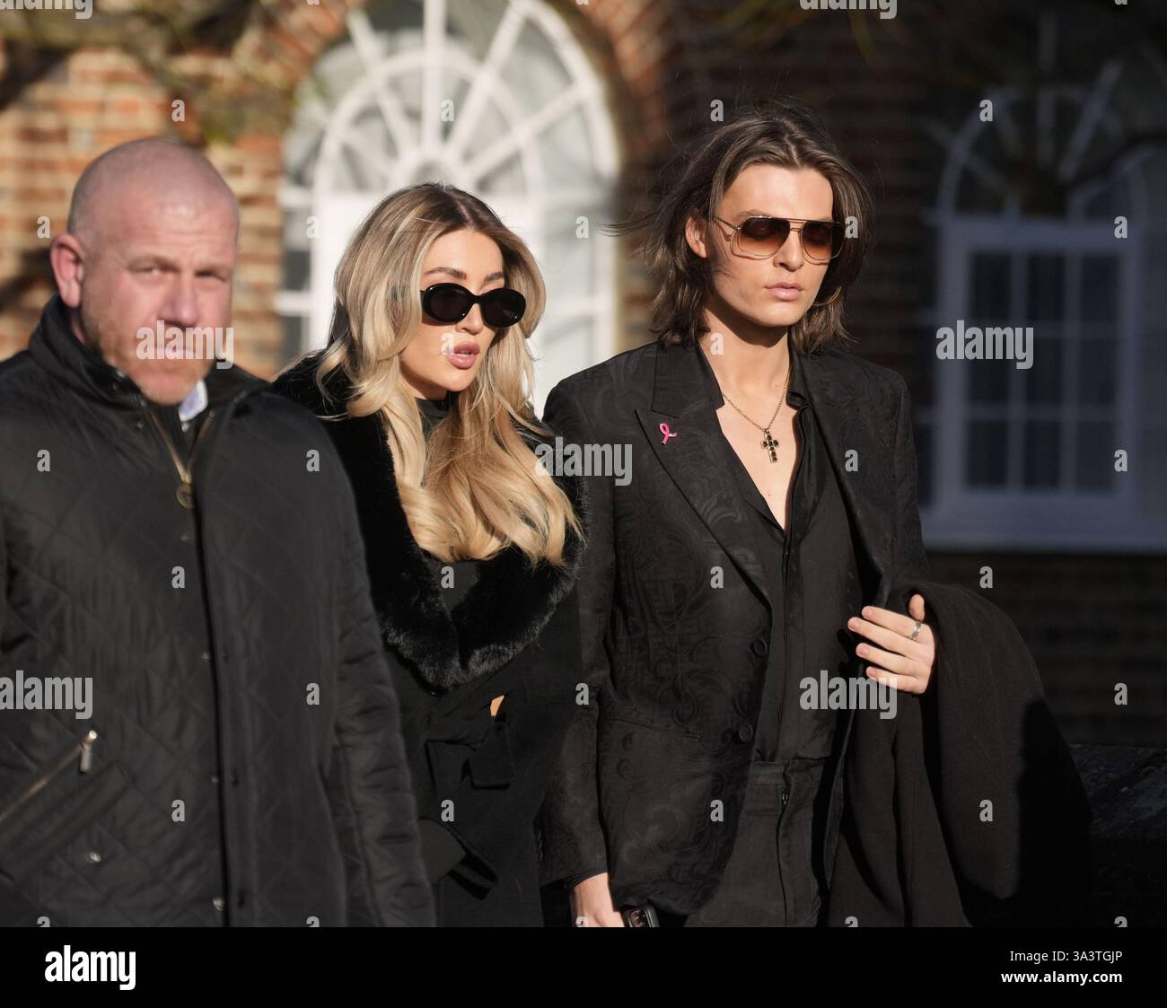 Damian Hurley (right) and Kate Cassidy (centre) arrive for the funeral ...