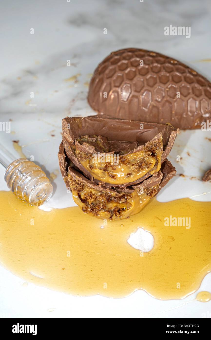 Closeup of Brazilian honey cake filling inside chocolate Easter egg ...