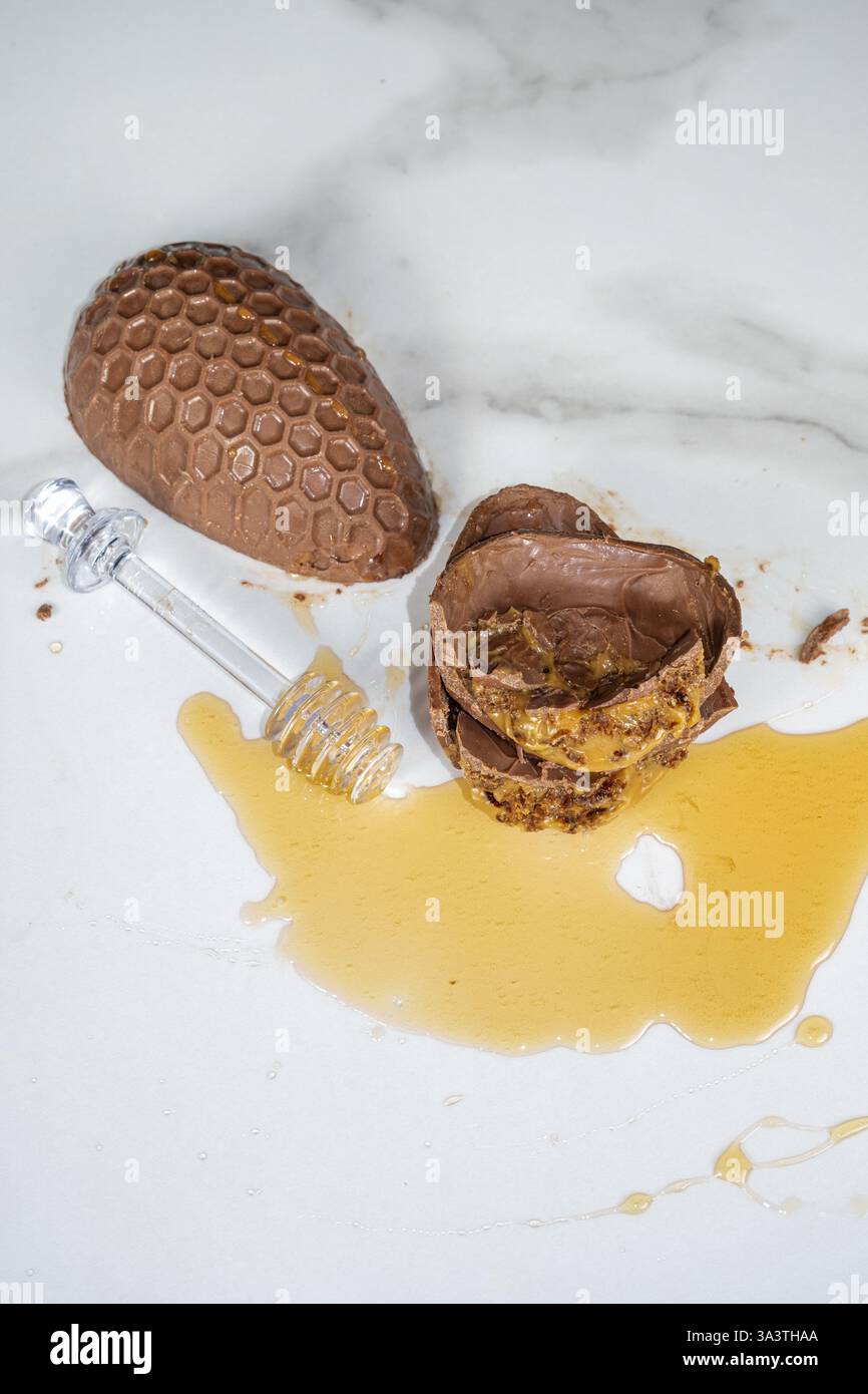Closeup of Brazilian honey cake filling inside chocolate Easter egg top ...