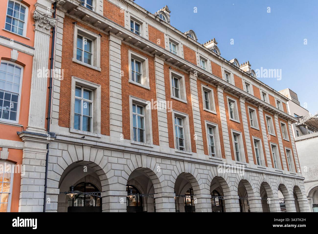 London, UK- September 19, 2024: Historic Red Brick Facade and Arched ...